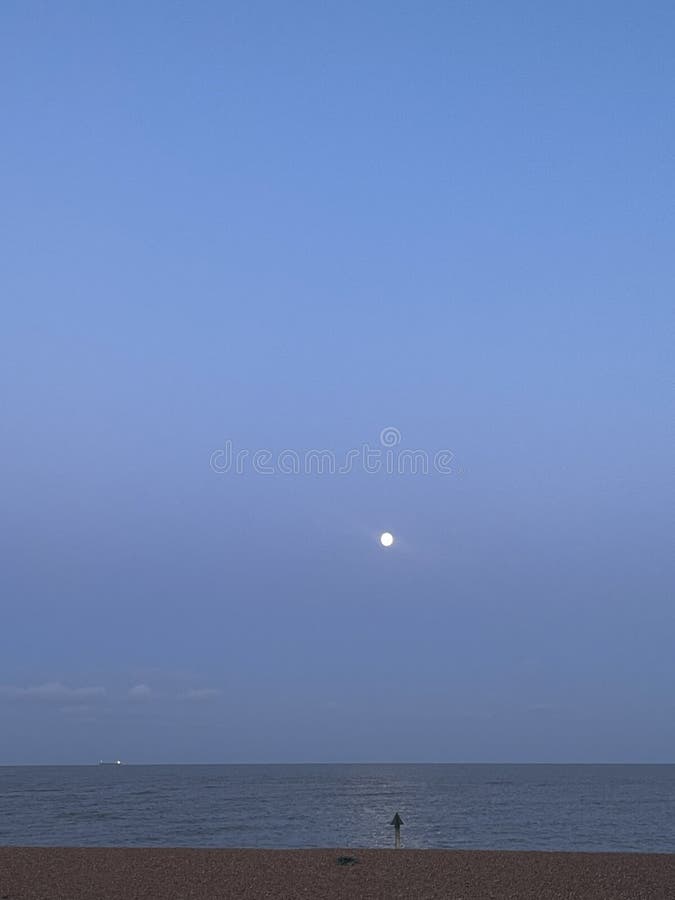 Full moon sunset in beach stock photo. Image of dawn - 282433414
