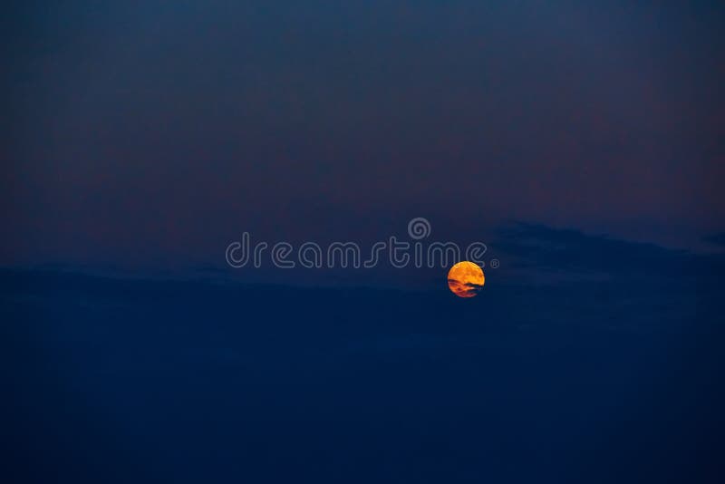 Full moon at sunset stock image. Image of night, light - 80356069