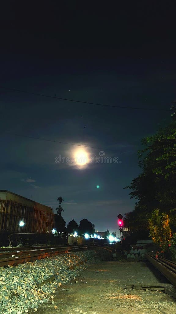 Full moon on train tracks stock photo. Image of train - 276441410