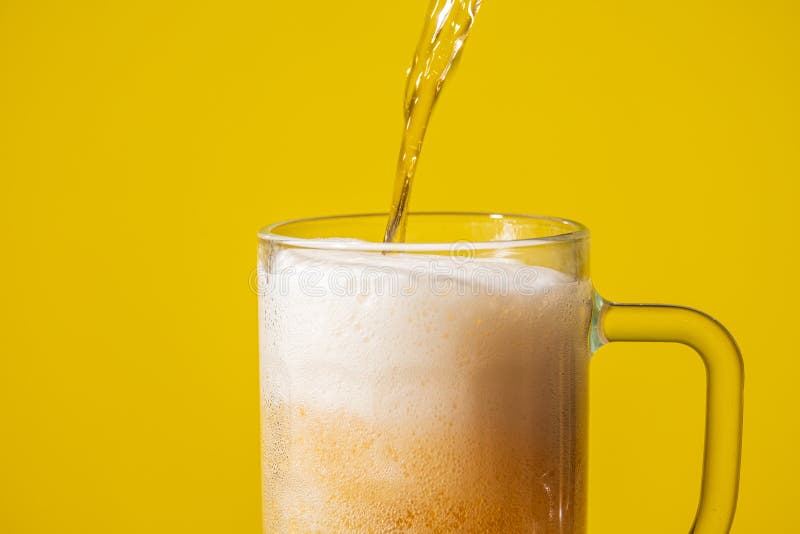 Full Mug with Cold Frothy Beer on Yellow Stock Image - Image of ...