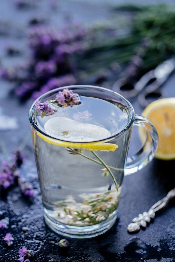 Lavender tea with lemon stock photo. Image of glass - 125633984