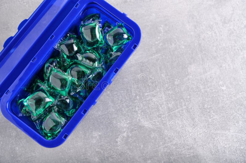 Full Package with Green Laundry Capsules Concrete Background. Stock ...