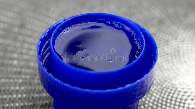 Full Plastic Cap with Blue Laundry Liquid Detergent Close Up. Stock ...