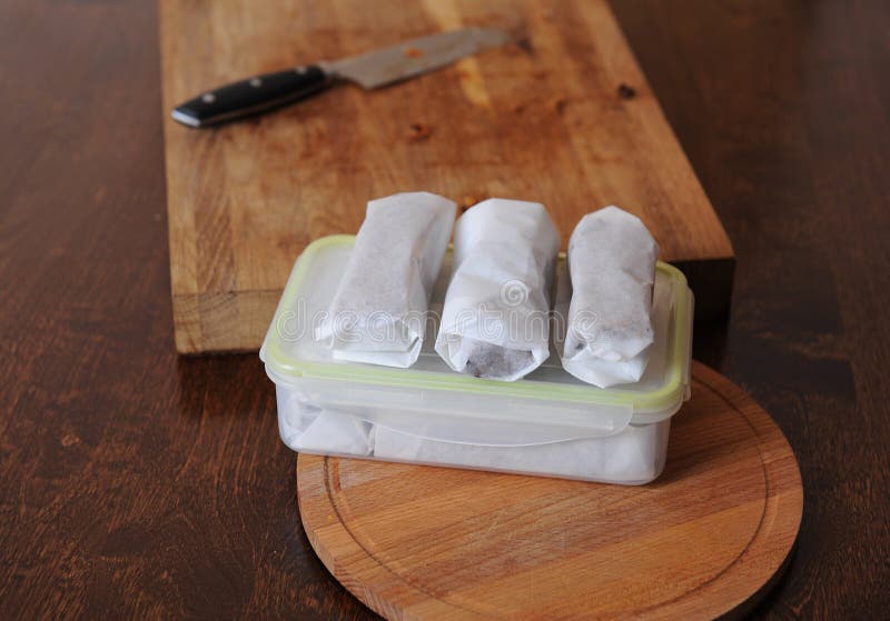 Full Plastic Container with Wrapped Baking Parchment Paper Bars Inside ...