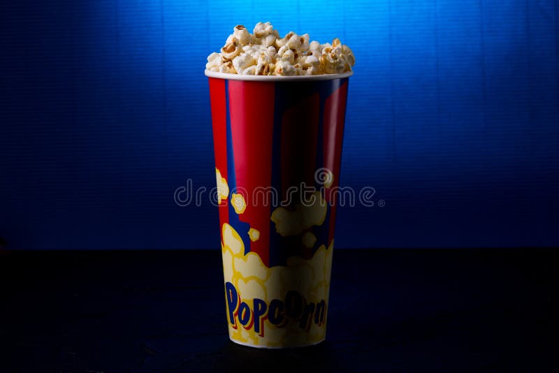 Full Popcorn Bucket Box on Dark Blue Background. Stock Image - Image of ...
