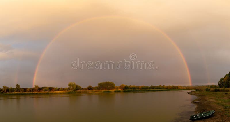 Full Rainbow Over a Lake at Sunset Stock Photo - Image of horizon ...