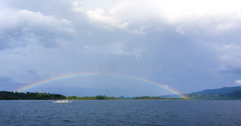 Full Rainbow Over Tropical Island Stock Photo - Image of full, resort ...