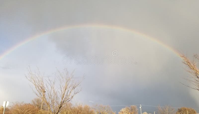 Full Rainbow in Rainy Sky stock image. Image of rainy - 139983523
