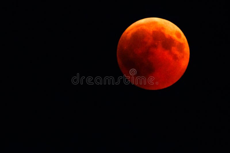 Total red lunar eclipse stock photo. Image of perigee - 137469930