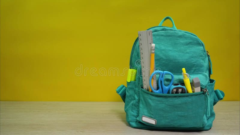 Full of School Accessories Schoolbag on the Desk. Animation of Opening ...