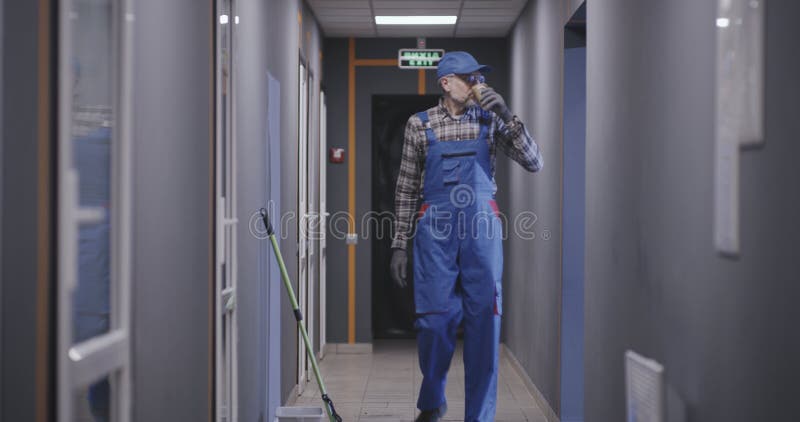 Janitor Checking Rooms in Building Stock Photo - Image of walking ...