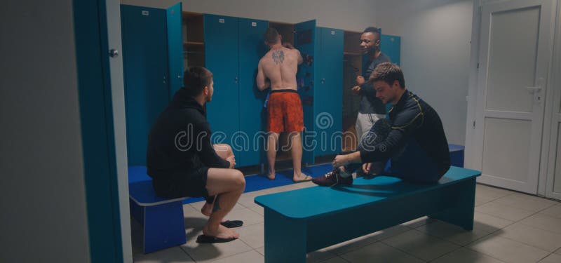 Men Laughing in Locker Room Stock Image - Image of indoors, sportsmen ...