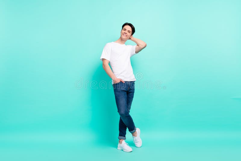 Full Size Photo Of Cool Brunet Hairdo Teenager Guy Stand Wear T Shirt Jeans Isolated On Teal