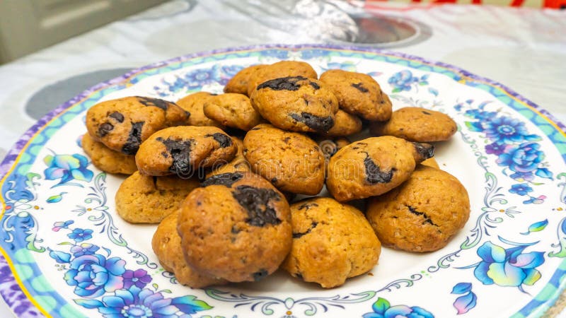 Full Stacks of Cookies with Chocolate Chips on a Plate at the Table ...