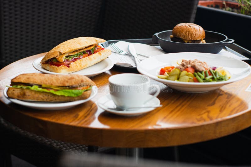 Full Table of Delicious and Different Dishes in Cafe with Cup of Coffee ...