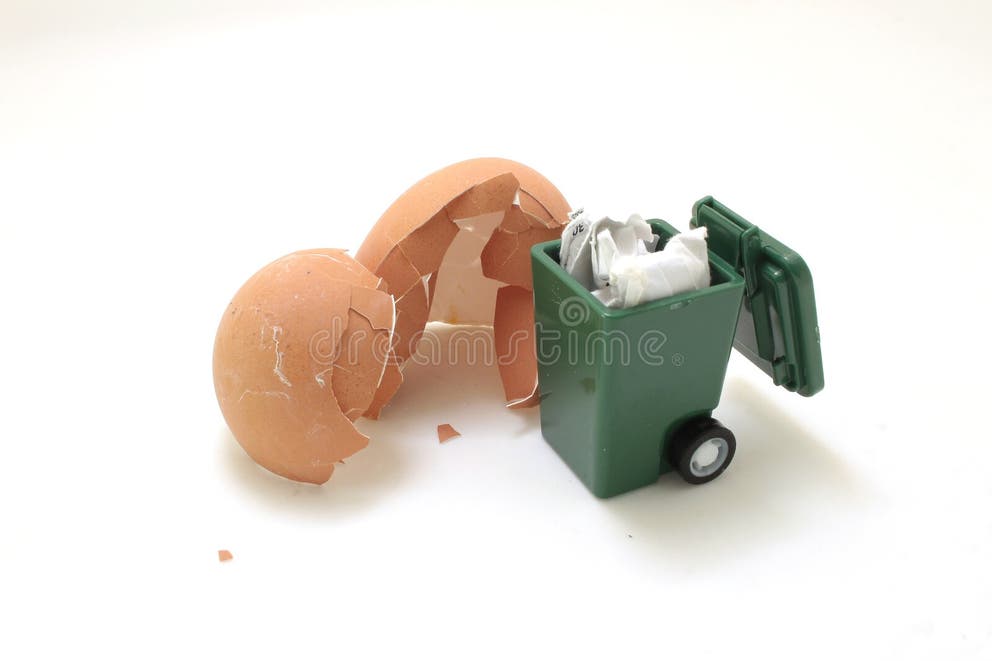 A Full Trash Bin with Egg Shells, Paper, and Plastic Waste Stock Image ...