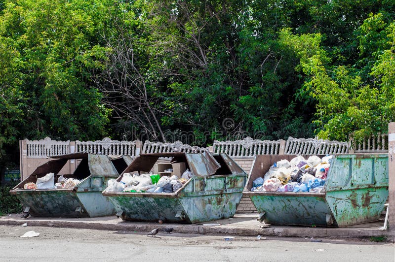 Full Trash Bins in a City. Garbage Cans in a Town Stock Image - Image ...