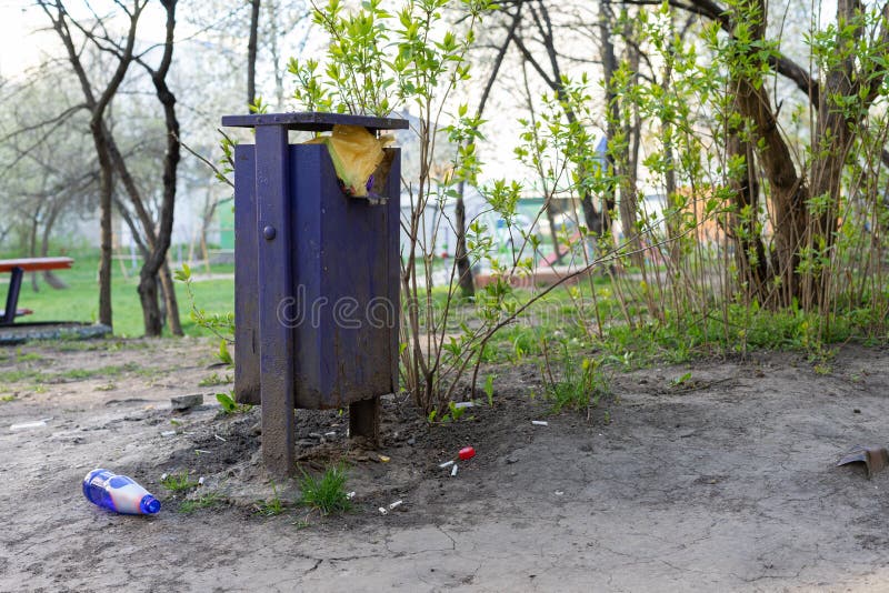 Full Trash Can and Bottle on the Ground Editorial Stock Photo - Image ...