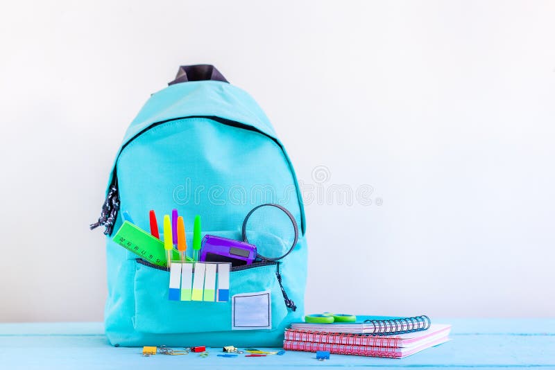 Full Turquoise School Backpack with Stationery on Table Stock Photo ...