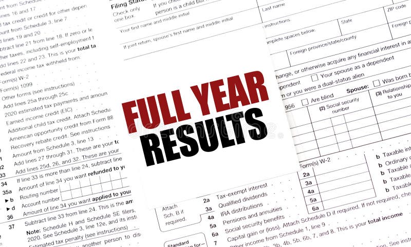 FULL YEAR RESULTS on White Sticker with Tax Forms Stock Photo - Image ...