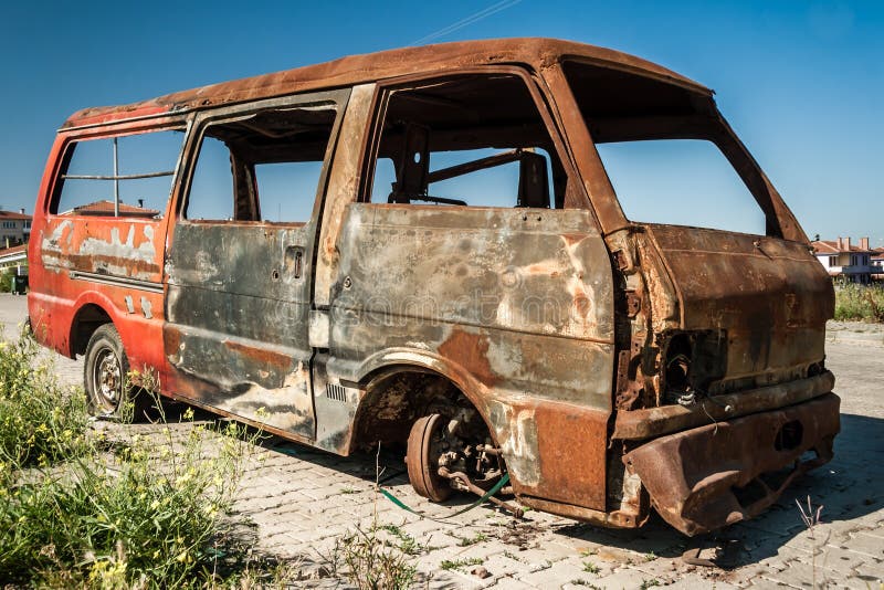 Fully burned car on a road stock image. Image of broken - 117979223