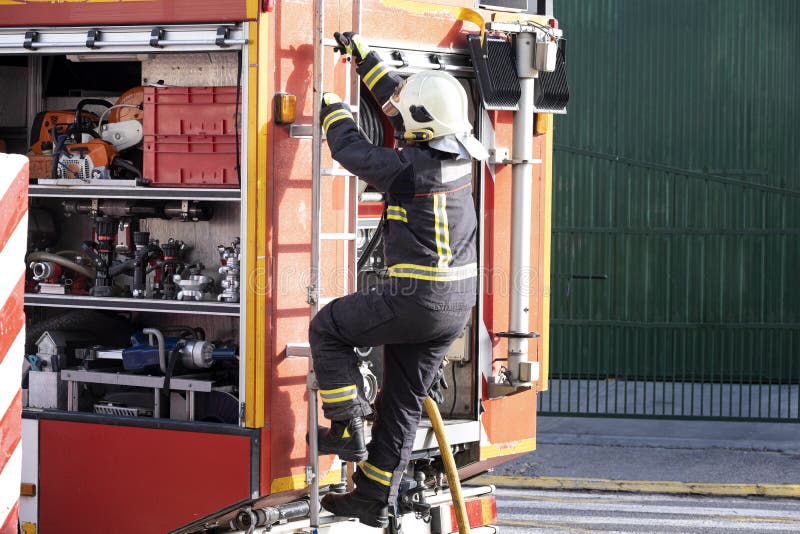 Fireman Climbing Ladder on Hydrant Stock Photo - Image of plug, ladder ...