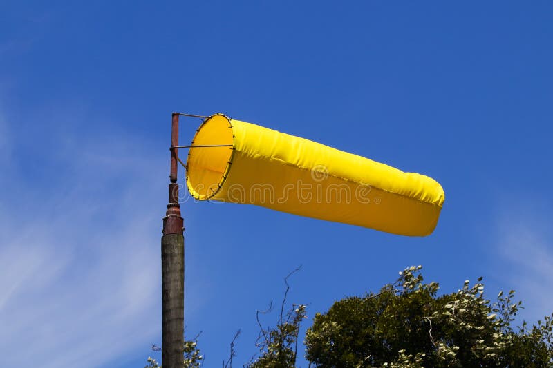 Fully Erect Bright Yellow Wind Indication Sock Stock Photo - Image of ...