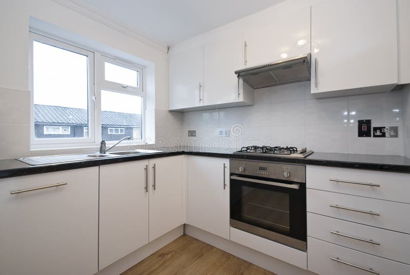 Fully Fitted Modern Kitchen in White Stock Image - Image of chrome ...