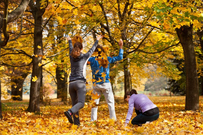 Happy Family Playing with Autumn Leaves in Park Stock Image - Image of ...