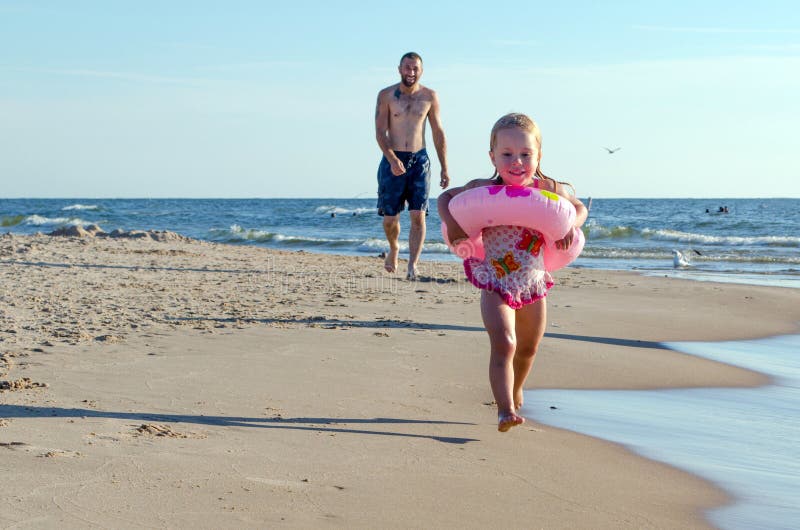 Fun on the beach stock image. Image of active, parent - 26029925