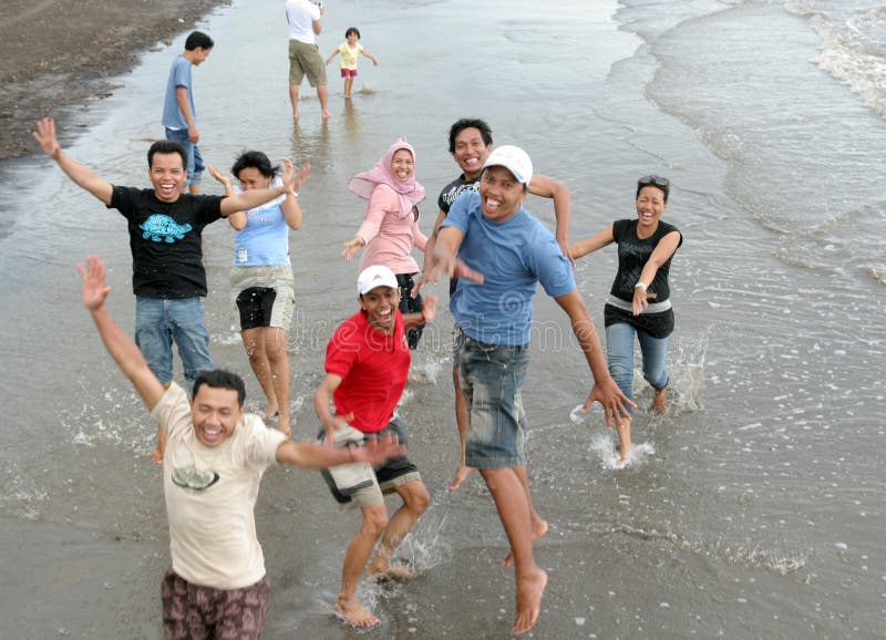 Fun on beach stock image. Image of holiday, jump, beach - 8552031