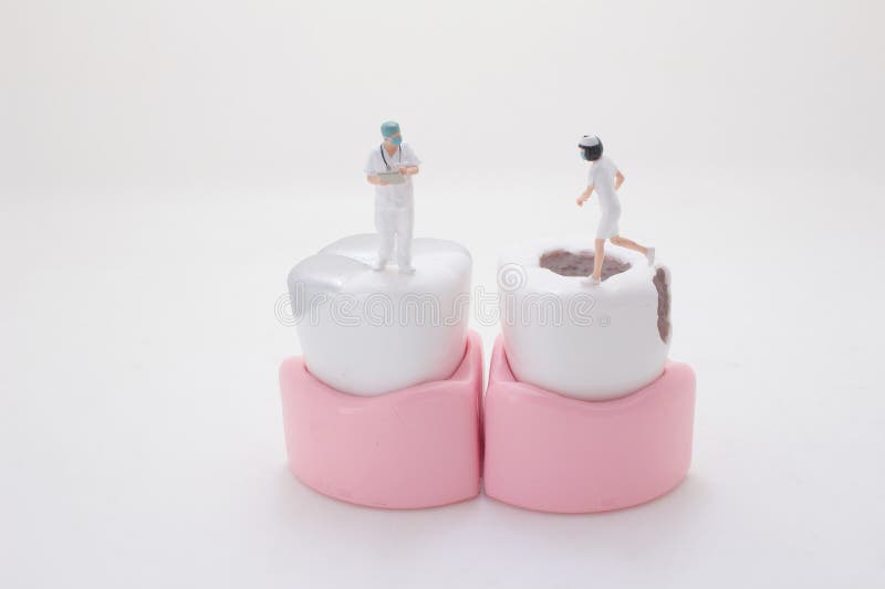 The Fun of Figure Dentist Repairing Human Teeth with Gums a Stock Photo ...