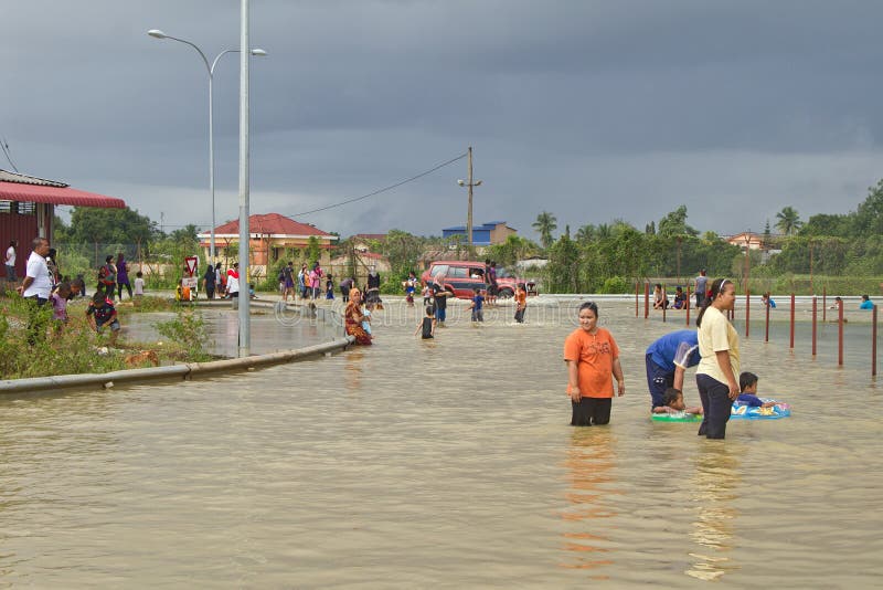 Fun in Flood Water editorial stock image. Image of families - 22269454