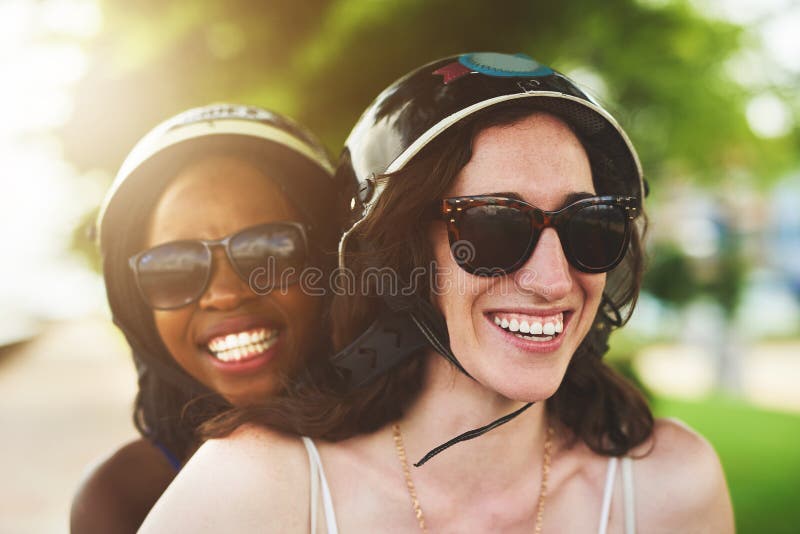 The Fun Just Never Stops. Two Friends Enjoying a Ride on a Scooter ...