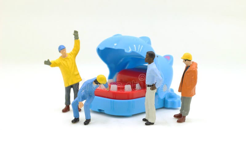 A Fun of Mini Figure Checking the Toy Mechanical Stock Photo - Image of ...