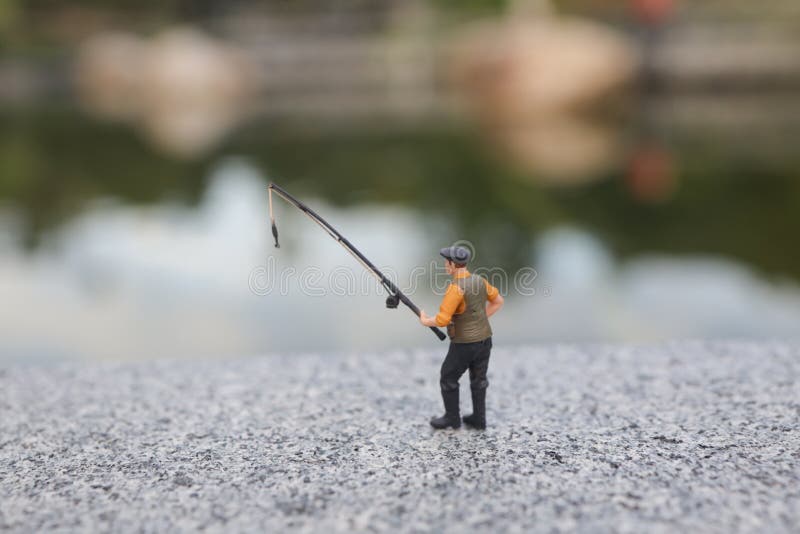 A Fun of Mini Figure is Fishing Stock Photo - Image of toys, fisherman ...