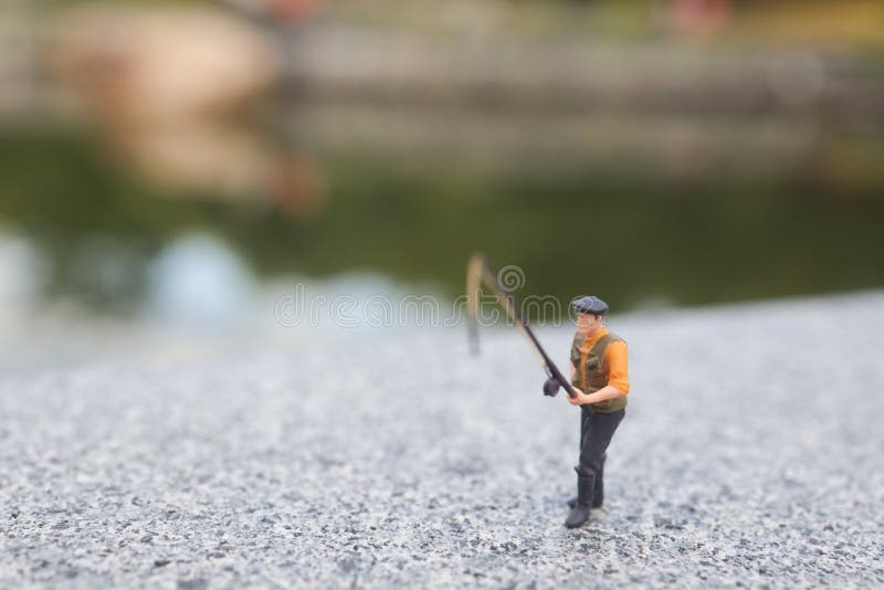 A Fun of Mini Figure is Fishing Stock Image - Image of father, fishing ...