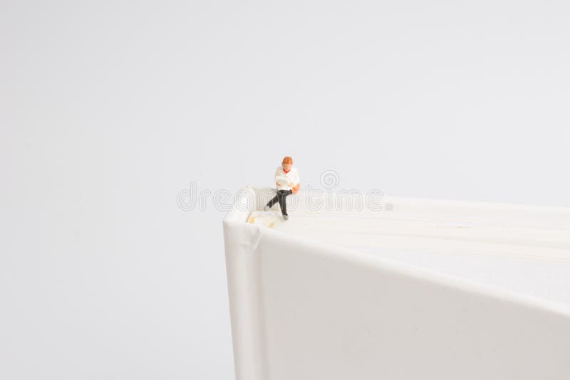 The Fun of Mini Figure Reading on Book Stock Photo - Image of paper ...