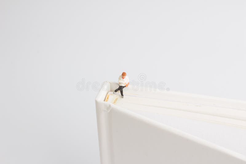 The Fun of Mini Figure Reading on Book Stock Image - Image of ...