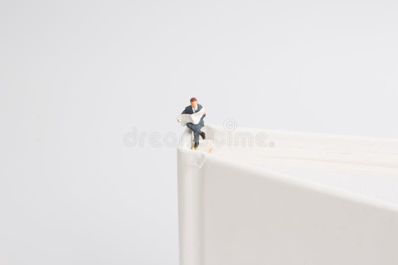 The Fun of Mini Figure Reading on Book Stock Photo - Image of figure ...