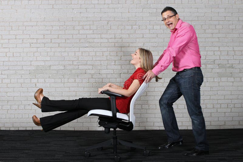 Fun at the office stock image. Image of jeans, couple - 21247457