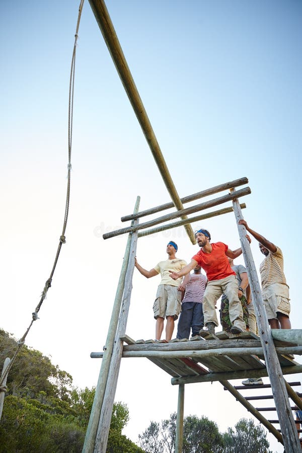 This is the Fun Part. a Group of Men Going through an Obstacle Course ...