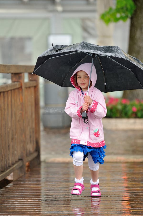 Fun in the Rain stock photo. Image of sandals, pink, blue - 37452054