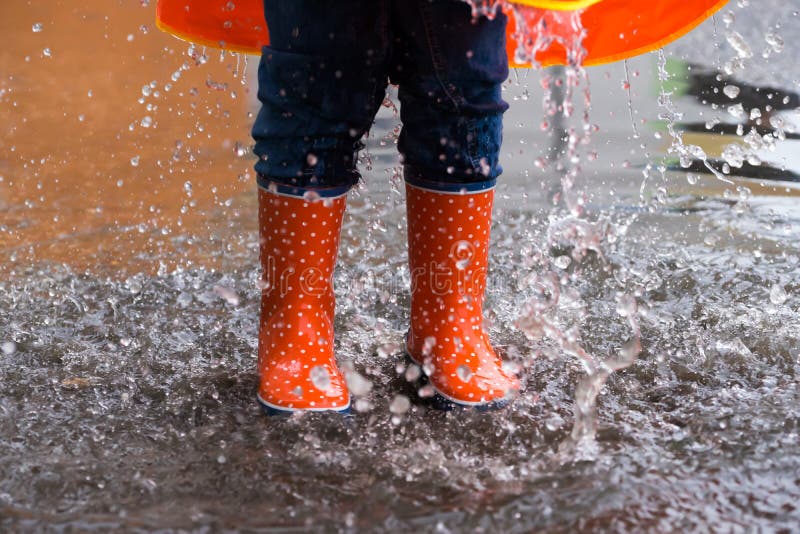 Fun in the rain stock image. Image of boot, spring, gumboots - 71032363