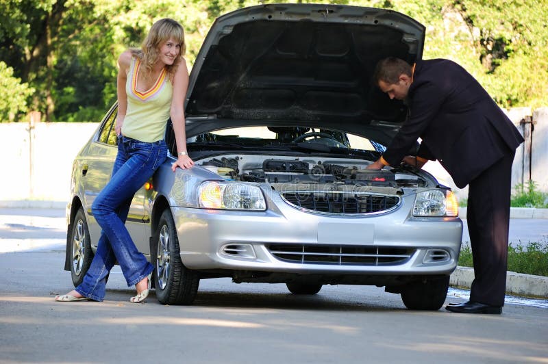 Fun Repair of the Broken Car Stock Photo - Image of mood, female: 12666442