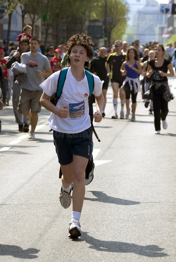 Fun Run runner in action editorial photo. Image of athletics - 13923806