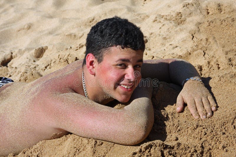 Fun in the Sand stock image. Image of adult, smile, laying - 4914303