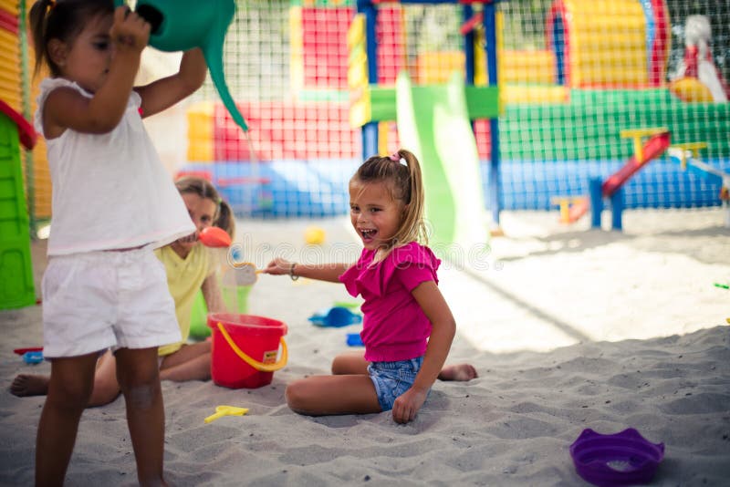 Fun in sand. stock image. Image of females, play, happy - 125815437