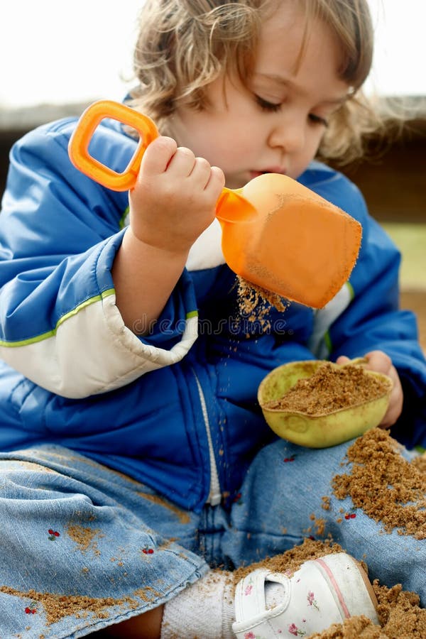 257 Child Pouring Sand Stock Photos - Free & Royalty-Free Stock Photos ...