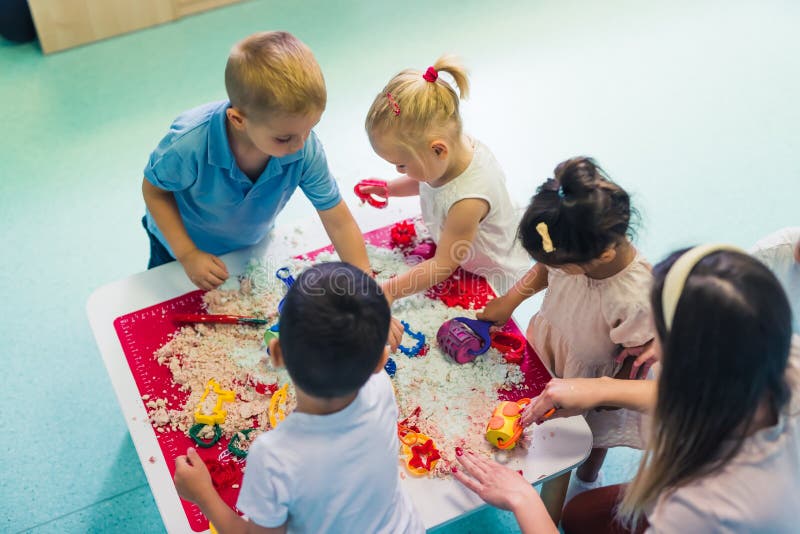 Fun Sensory Play with Moldable Kinetic Sand at Nursery School. Toddlers ...